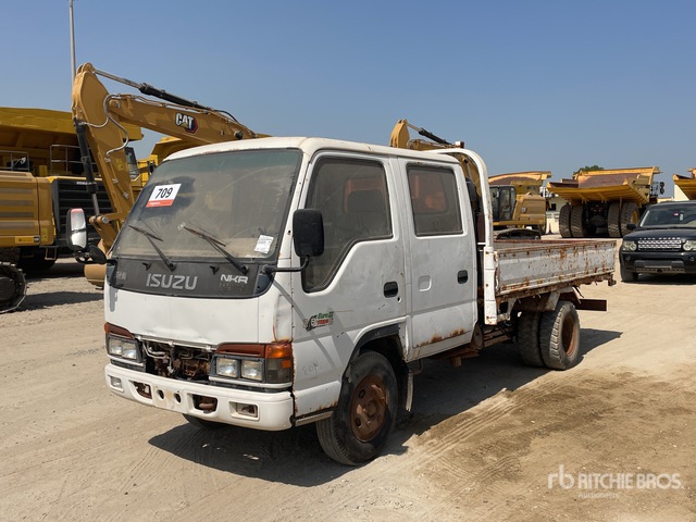 2010 Isuzu NKR 4x2 Crew Cab Flatbed Truck | Ritchie Bros. Auctioneers