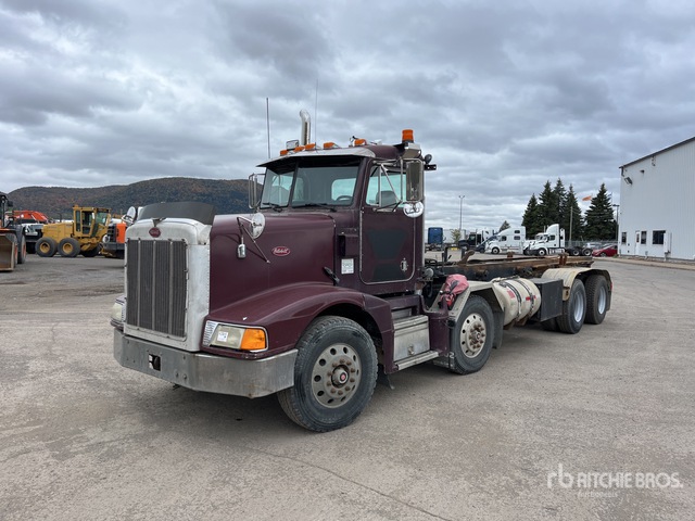 1996 Peterbilt 377 8x4 Twin-Steer Roll-Off Truck | Ritchie Bros ...