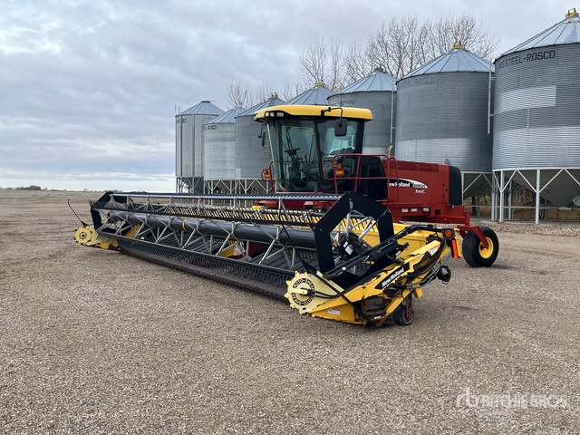 2007 New Holland HW325 36 ft Swather Windrower | Ritchie Bros. Auctioneers