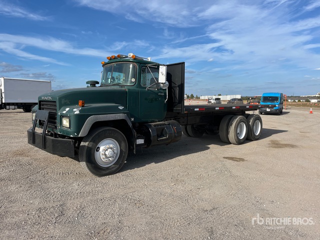 2001 Mack RD690S 6x4 Flatbed Truck | Ritchie Bros. Auctioneers