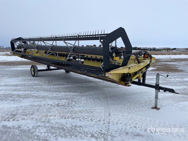 1999 Honey Bee SP30 30 ft Draper Combine Header | Ritchie Bros. Auctioneers