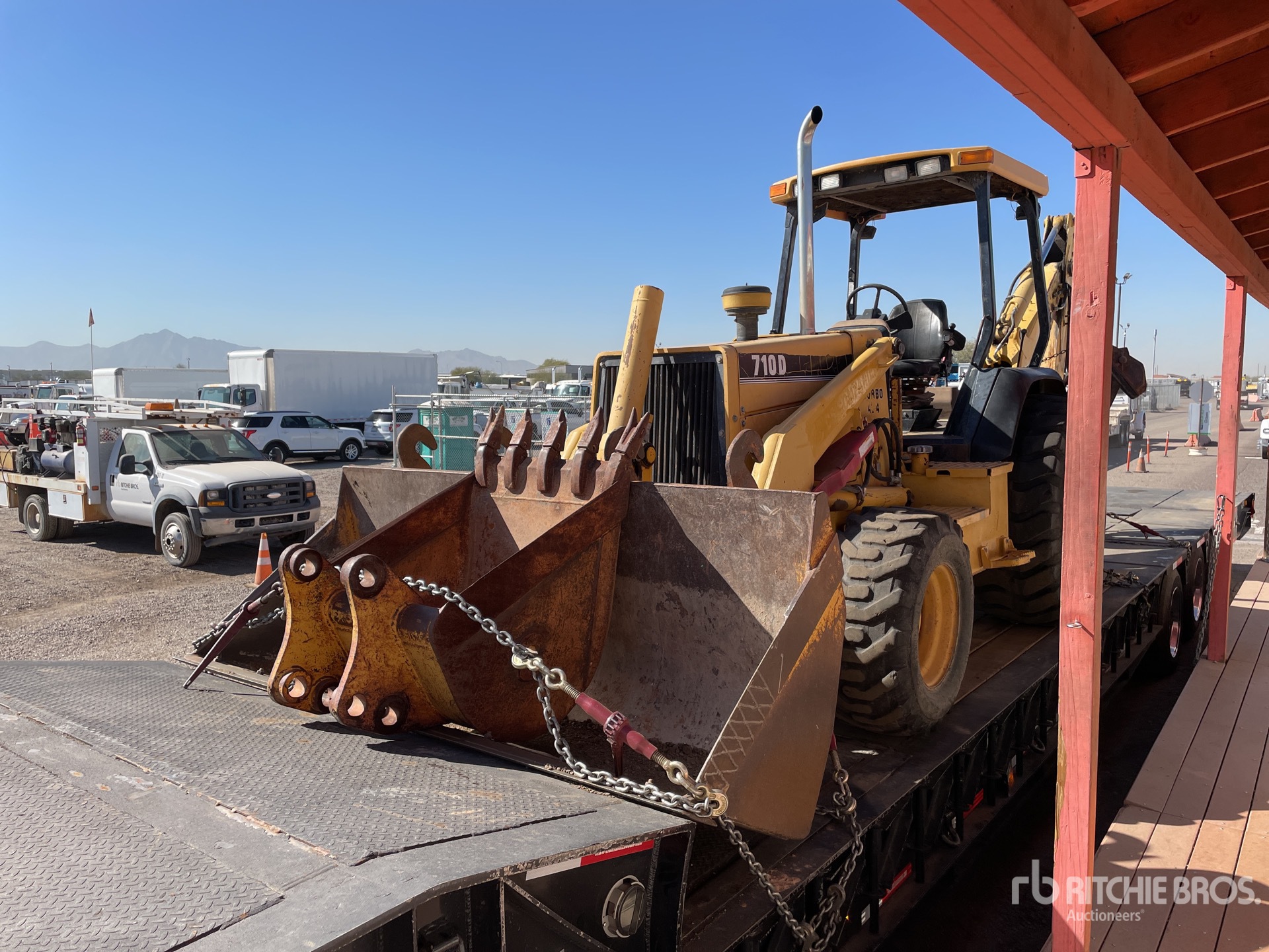 2002 John Deere 710D 4x4 Chargeuse-pelleteuse | Ritchie Bros. Auctioneers