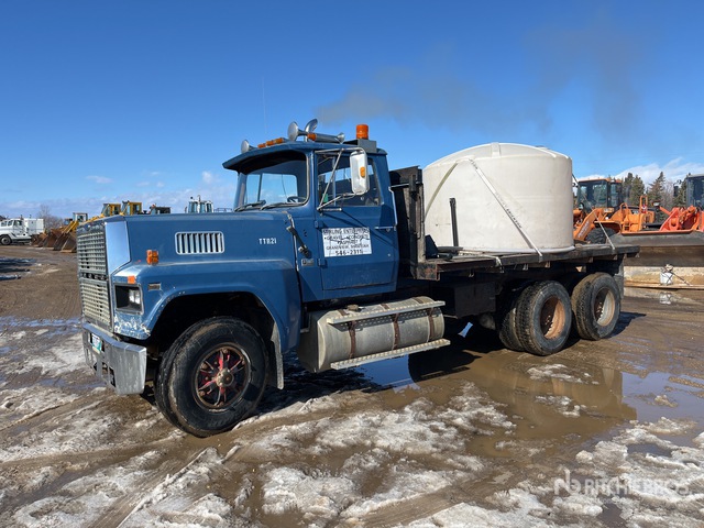 1985 Ford LTL9000 6x4 Camion à Plateau | Ritchie Bros. Auctioneers