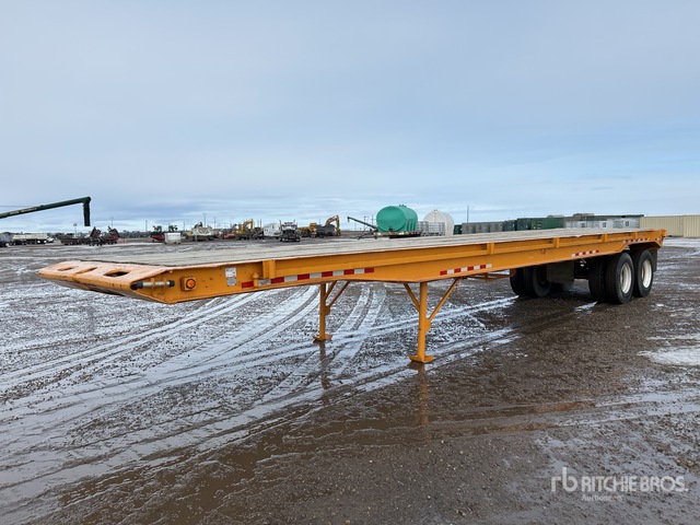 1978 McCovy 20 ton 40 ft T/A Flatbed Oilfield Trailer | Ritchie Bros. Auctioneers