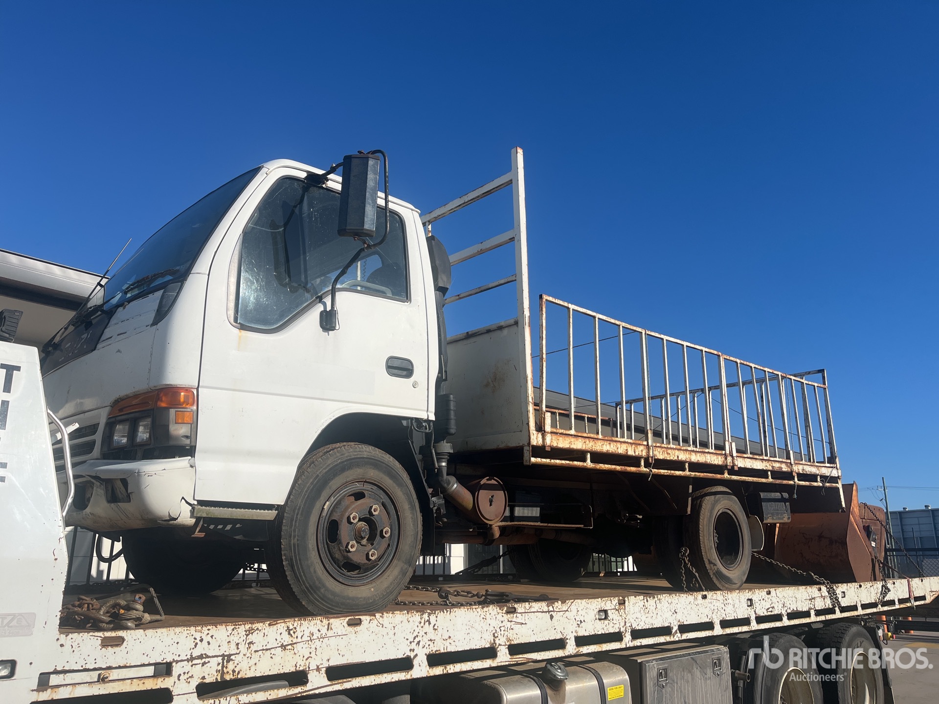 1995 Isuzu NPR 4x2 Flatbed Truck | Ritchie Bros. Auctioneers