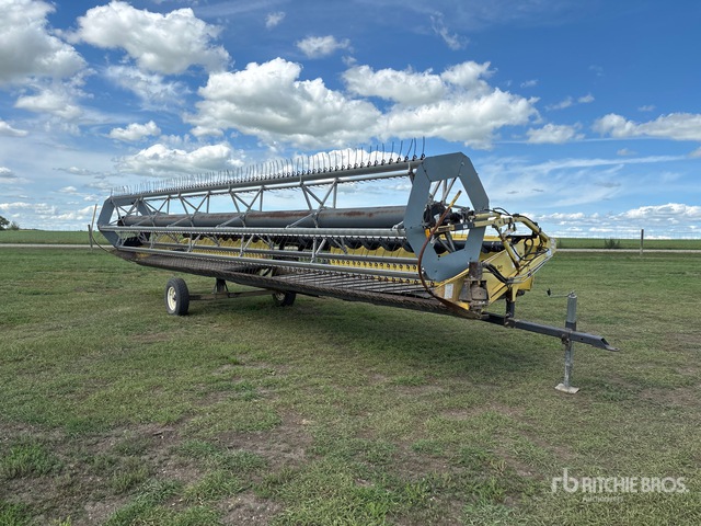 1997 Honey Bee SP30 30 ft Draper Combine Header | Ritchie Bros. Auctioneers