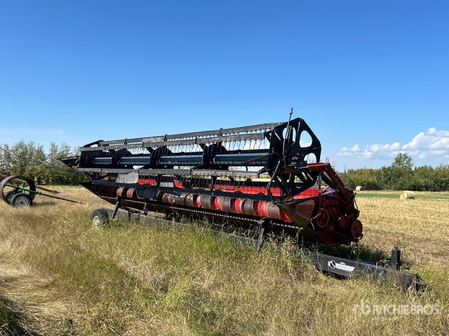 1990 Case IH 1010 25 ft Rigid Combine Header | Ritchie Bros. Auctioneers