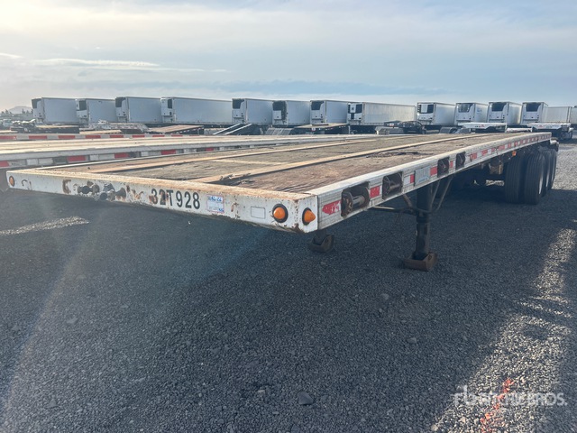 1989 Magnum 32 ft Tri/A B-Train Flatbed Trailer | Ritchie Bros. Auctioneers